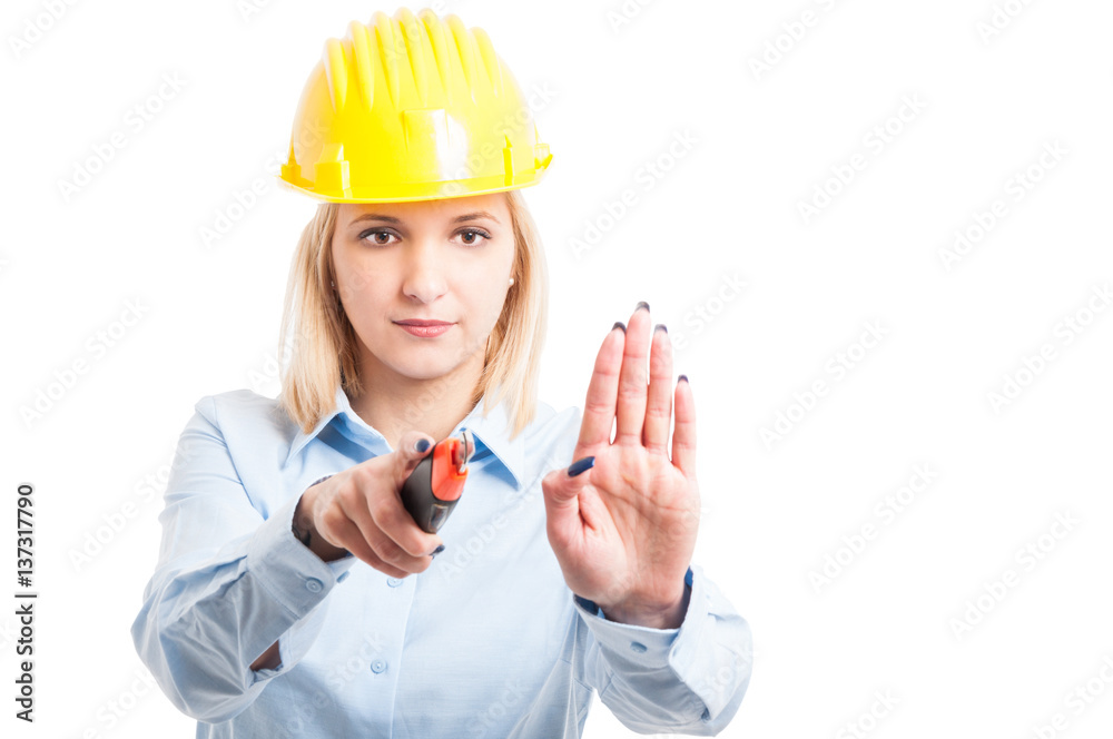 Female architect wearing helmet using cutter tool Stock Photo | Adobe Stock