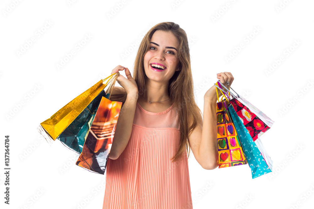good beautiful girl keeps two hands many packages with gifts is ...