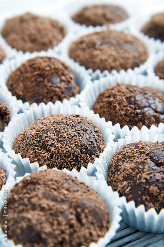Lots of sweet Brazilian candy Brigadeiro closeup. Delicious high ...