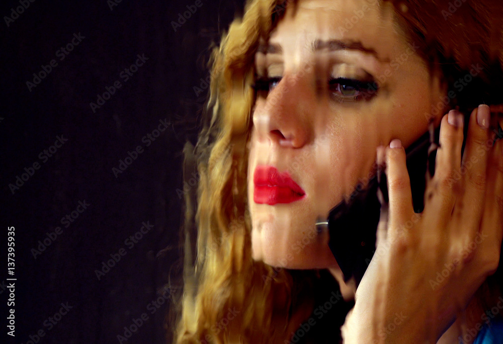 Woman crying by phone. Girl talking on phone . Portrait of sad female ...