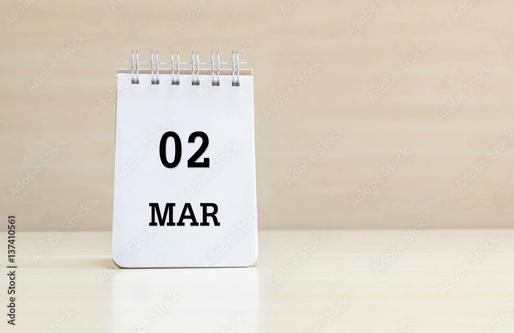 Closeup surface note book with black 2 mar word in page on blurred ...