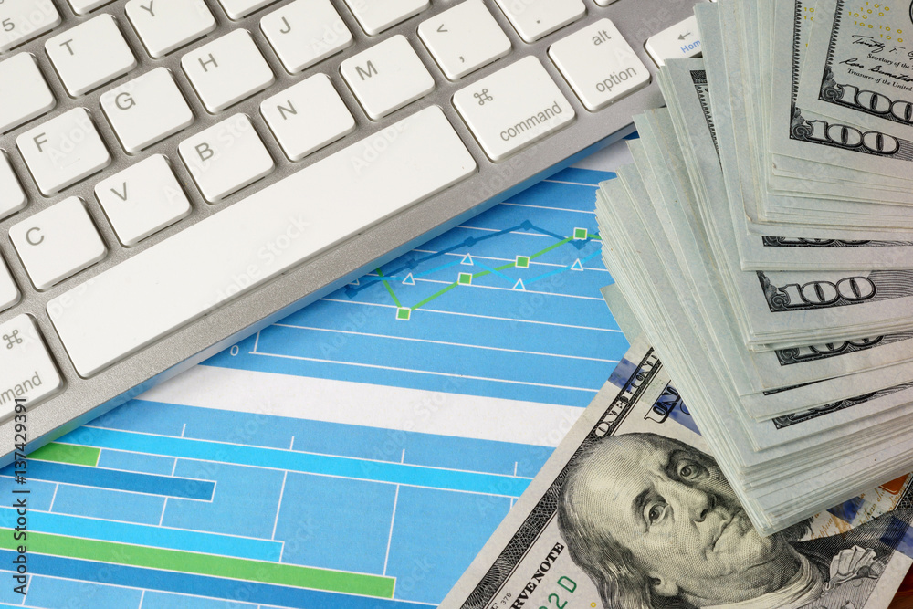 Keyboard, cash and and financial charts on a table. Stock Photo | Adobe ...