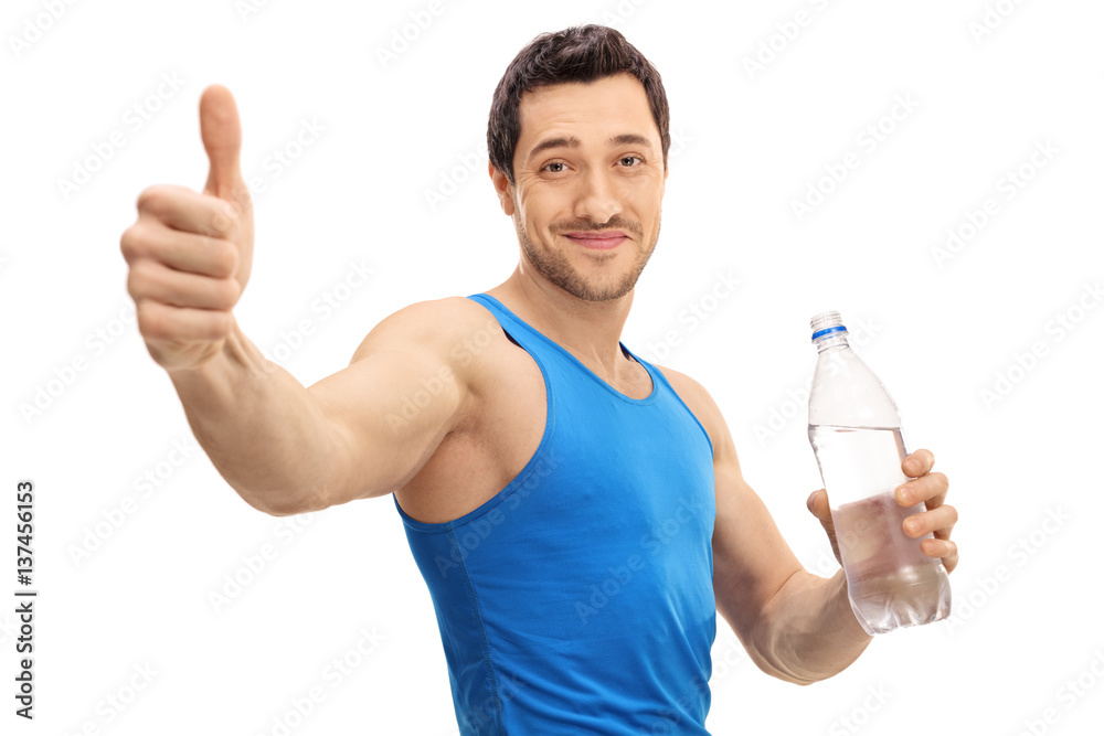 Guy holding bottle of water and making thumb up gesture Stock Photo ...