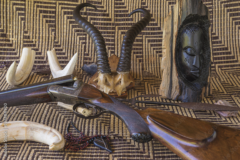 hunting in africa concept/hunting carbine,tasks,lancer on african mat ...