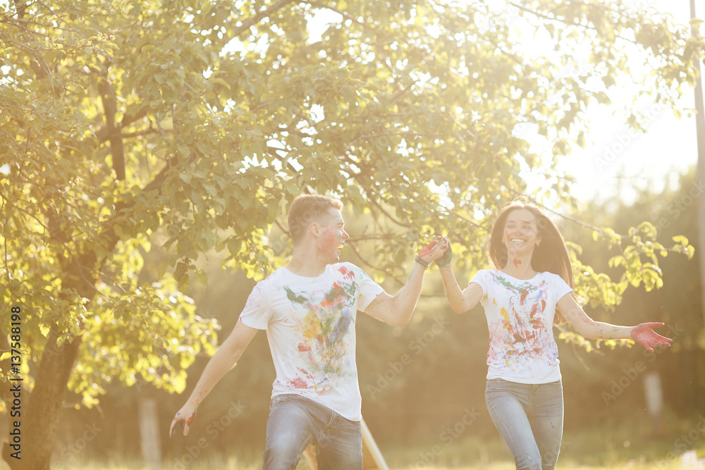 Young man and woman having fun outdoors. Pretty couple smiling and ...