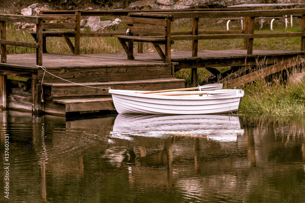 Small row boat sitting in pond Stock-Foto | Adobe Stock