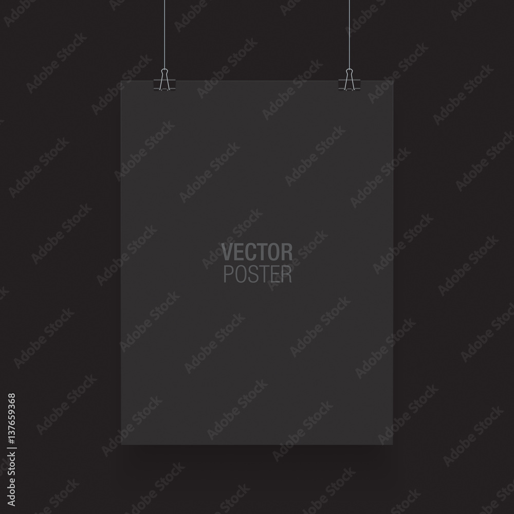Black vertical poster template hanging on clips, isolated on a black ...