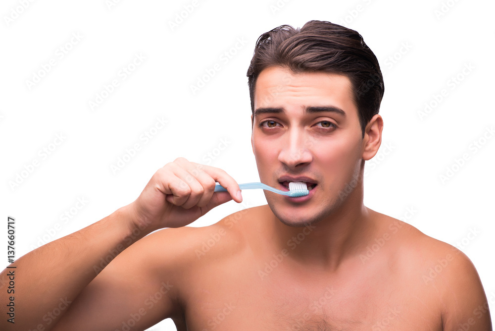 Handsome man brushing his teeth isolated on white Stock Photo | Adobe Stock
