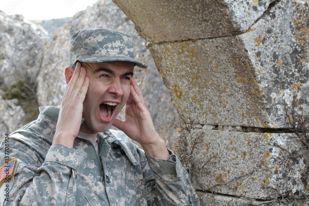 Army soldier screaming in front of some ruins with copy space Stock ...