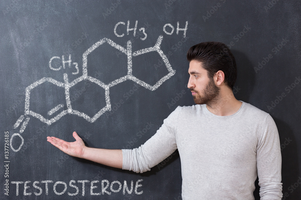 chemical structure of testosterone molecule drawn on chalkboard ...