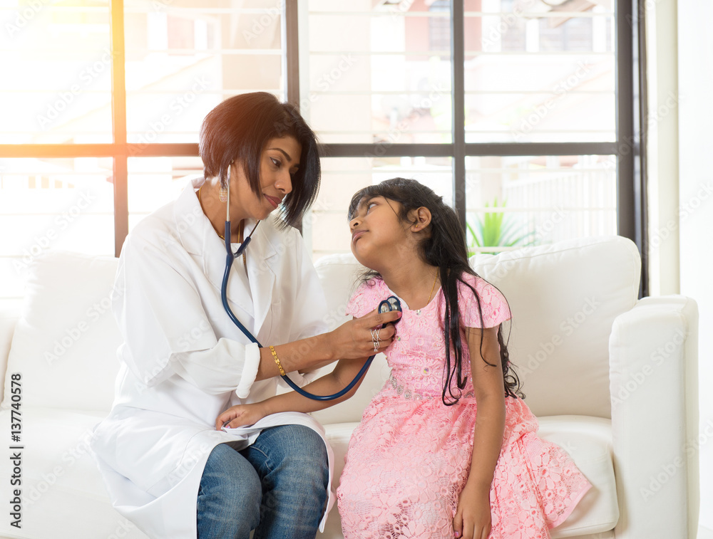indian female doctor treating young patient Stock Photo | Adobe Stock