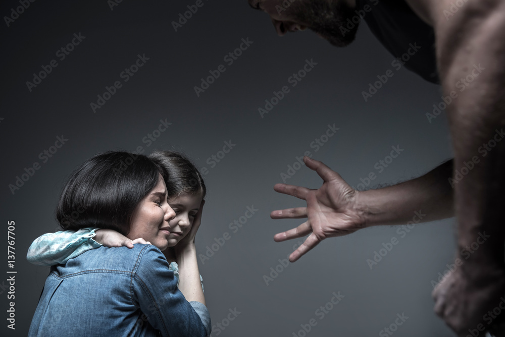 Bad father lifting his arm on his family Stock-Foto | Adobe Stock