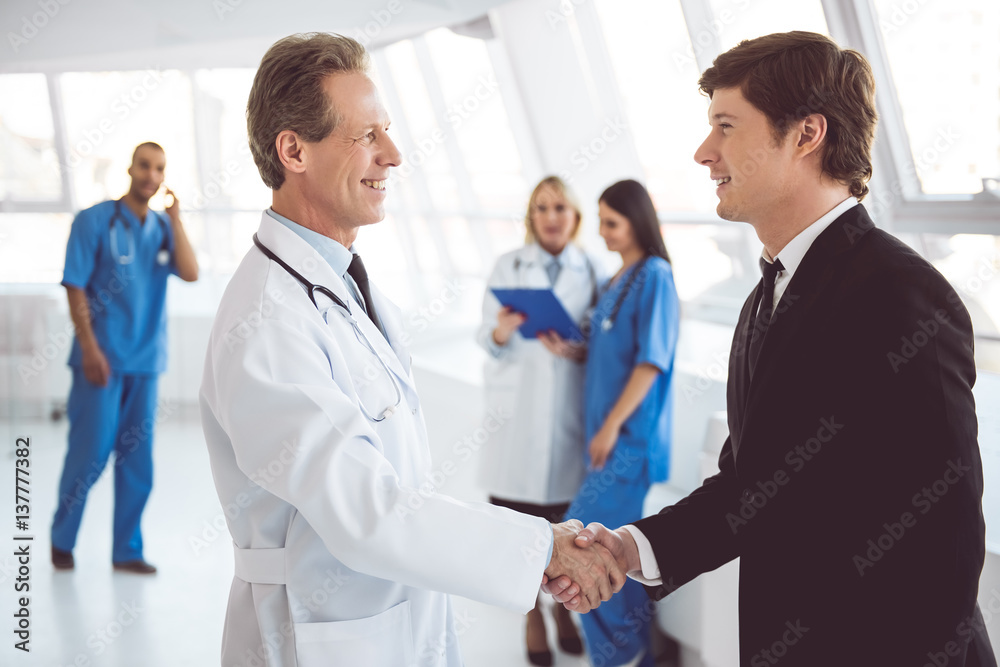 Doctor and businessman Stock Photo | Adobe Stock