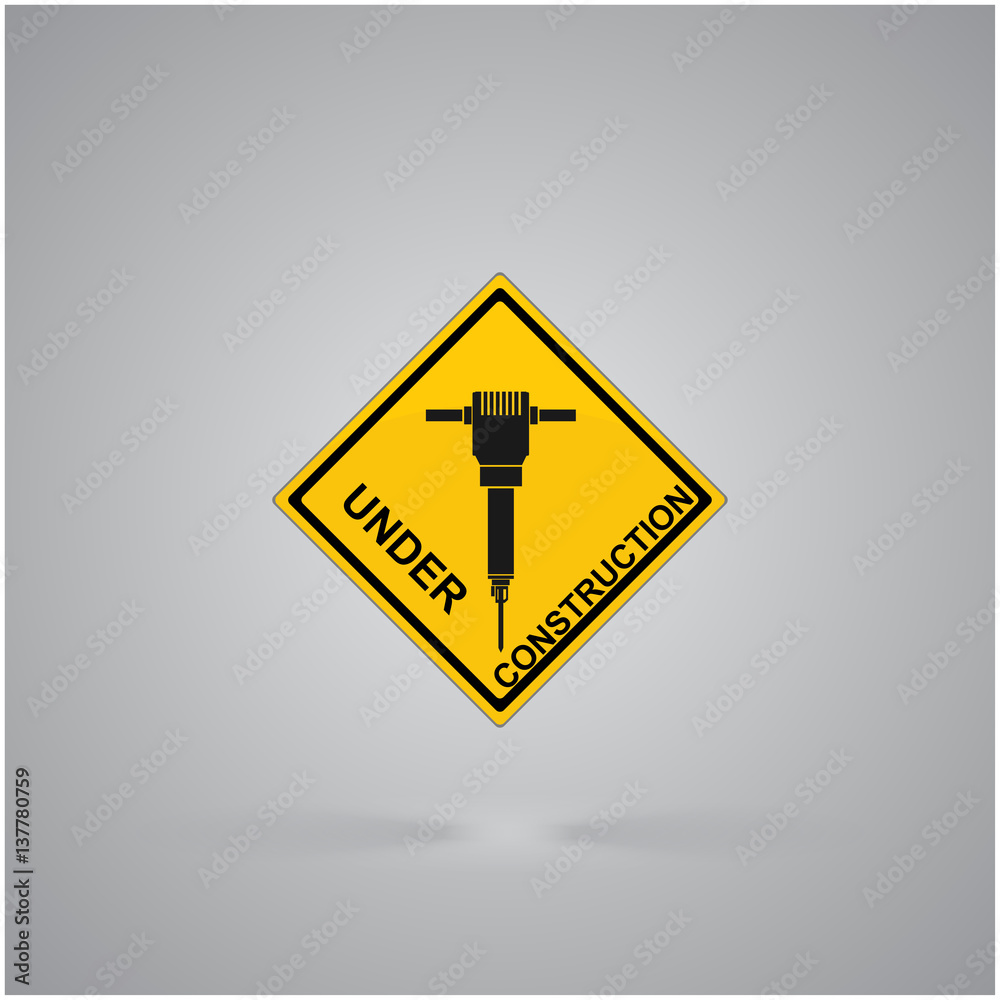 Under construction. Warning attention sign. Pneumatic plug ger hammer ...