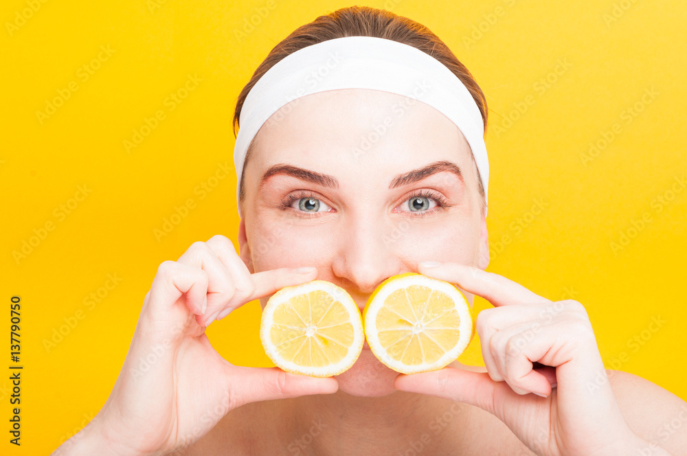 Beautiful woman face with juicy lemon Stock Photo | Adobe Stock