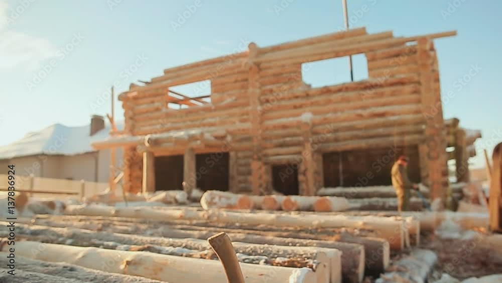 Construction of wooden houses. Winter construction site. Canadian angle ...
