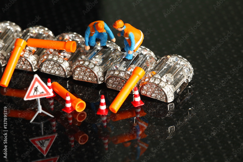 The miniature maintenance plastic model figure with small orange color ...