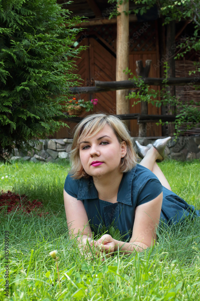 Haughty beauty. Young plump beautiful woman with short hair and green ...