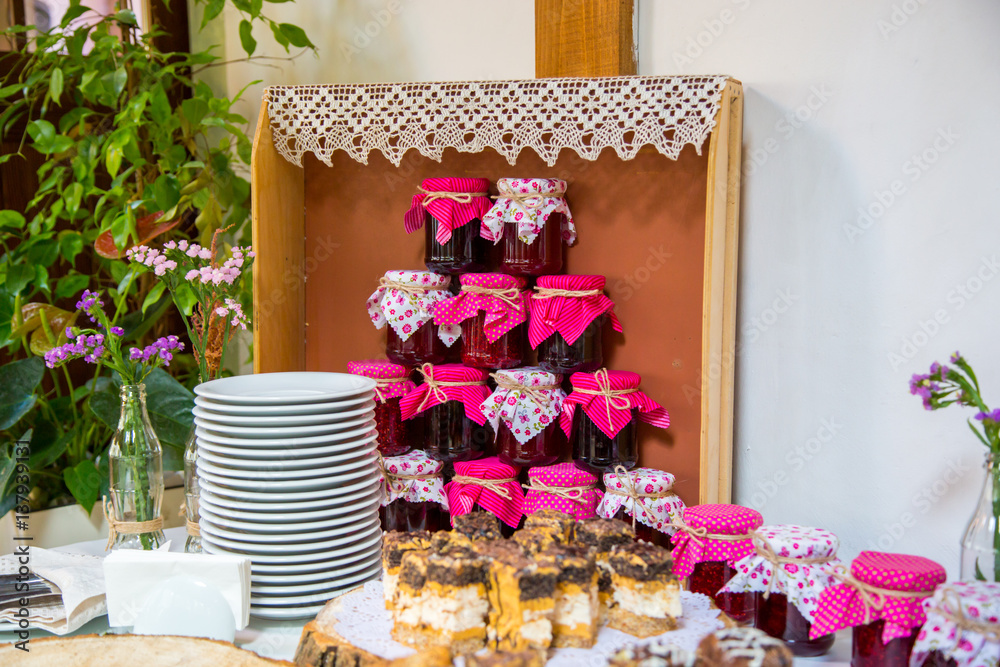 Jars of jam are on the buffet table in the shape of a pyramid Stock ...