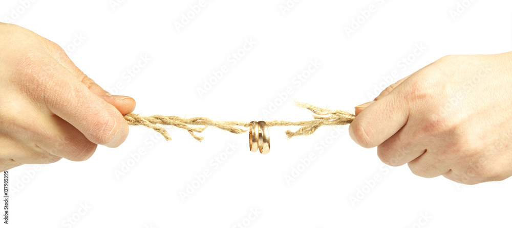 Two people pulling the rope and two golden rings in the middle of the ...