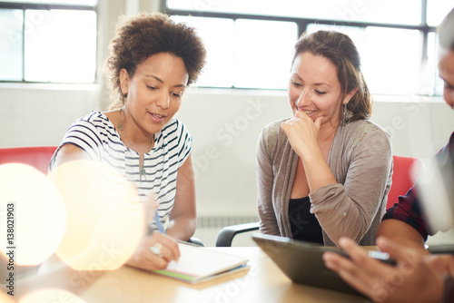 Unposed group of creative business entrepreneurs in an open concept ...