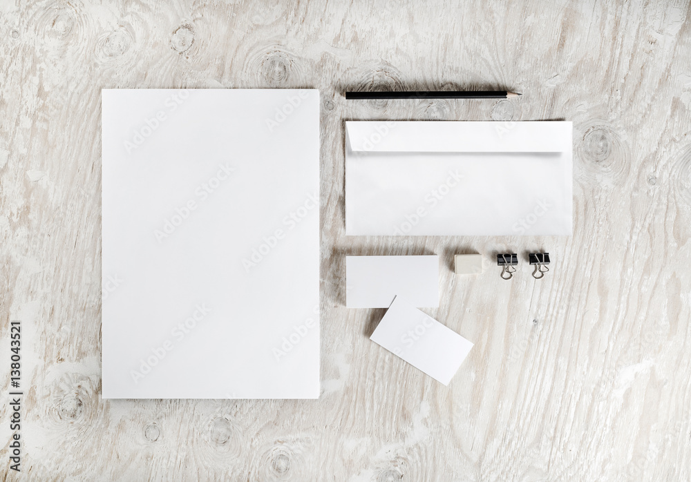 Photo of blank stationery set on light wooden table background ...