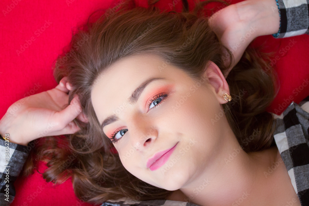 beautiful young girl . red fabric background Stock Photo | Adobe Stock