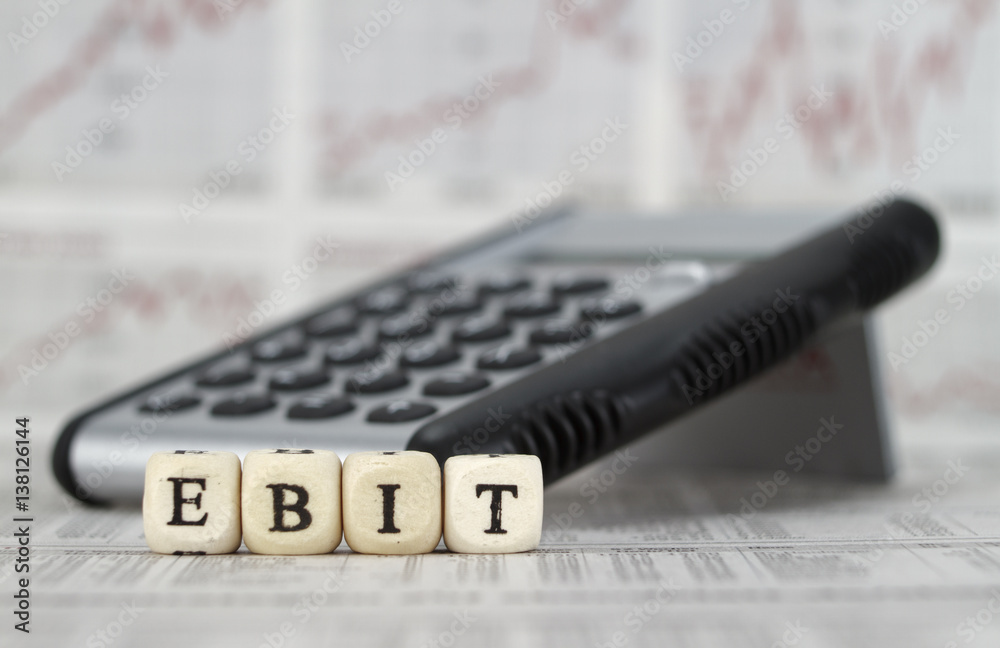 EBIT word built with letter cubes on newspaper background Stock Photo ...