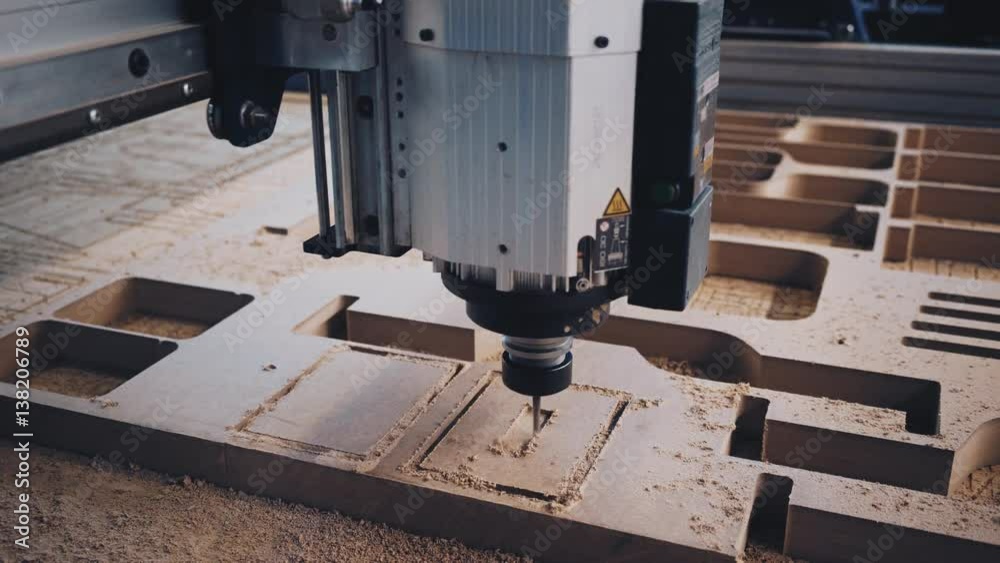 Close focus view on industrial drill of big automated wood cut machine ...