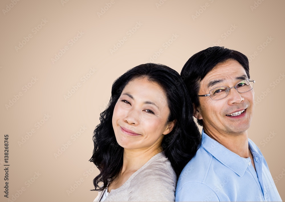 Happy Couple smiling against a neutral background Stock-Foto | Adobe Stock