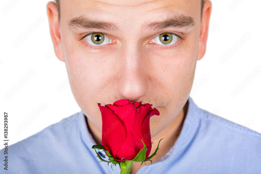 Handsome guy smelling red rose Stock-Foto | Adobe Stock
