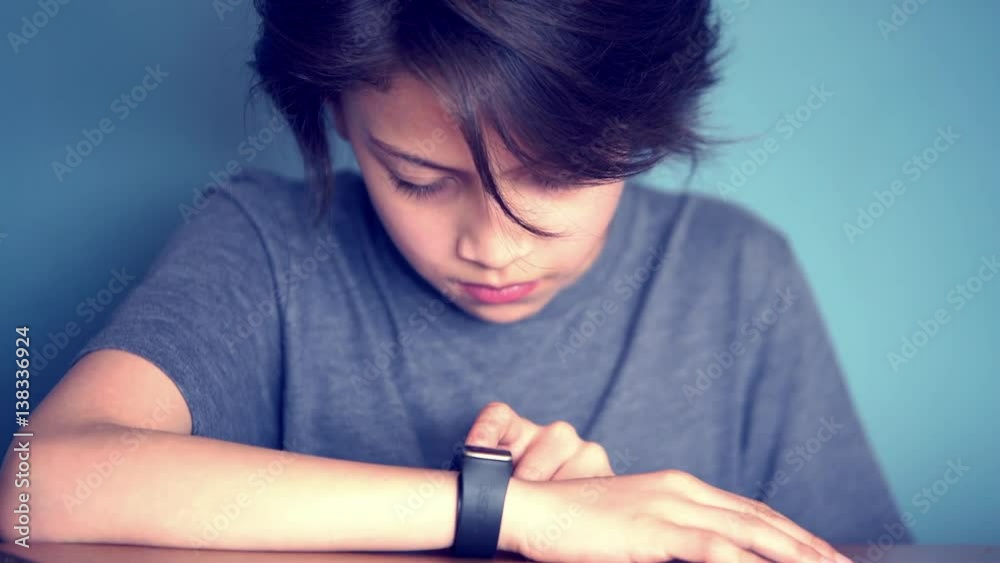 Boy using smartwatch Stock Video | Adobe Stock