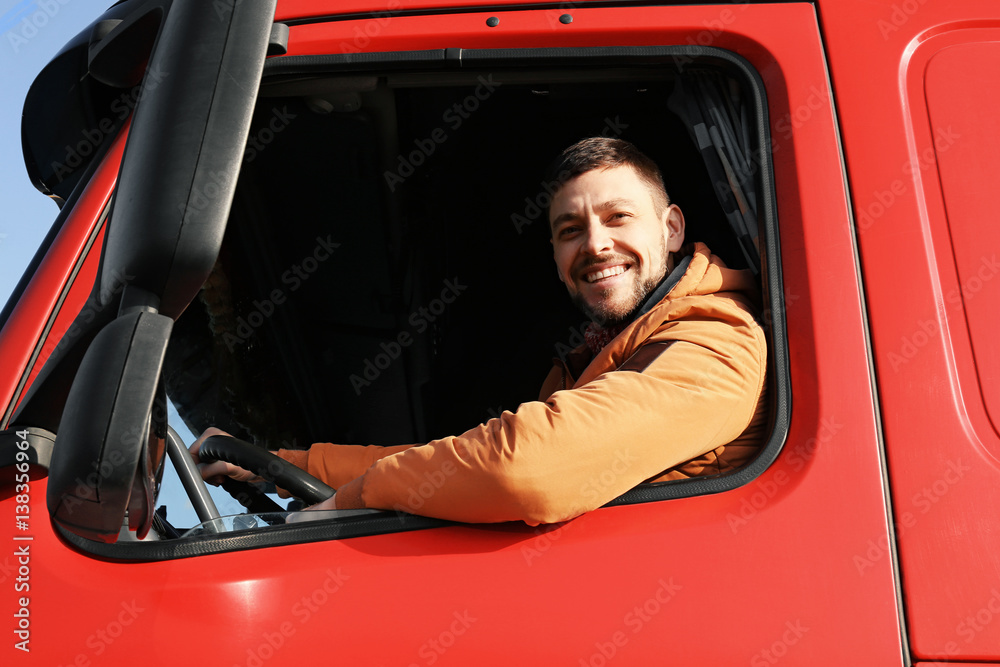 Male driver looking out of truck window Stock Photo | Adobe Stock