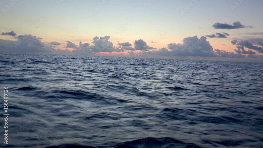 Open seas. Open water. Ocean waves during sunset golden hour time Stock ...