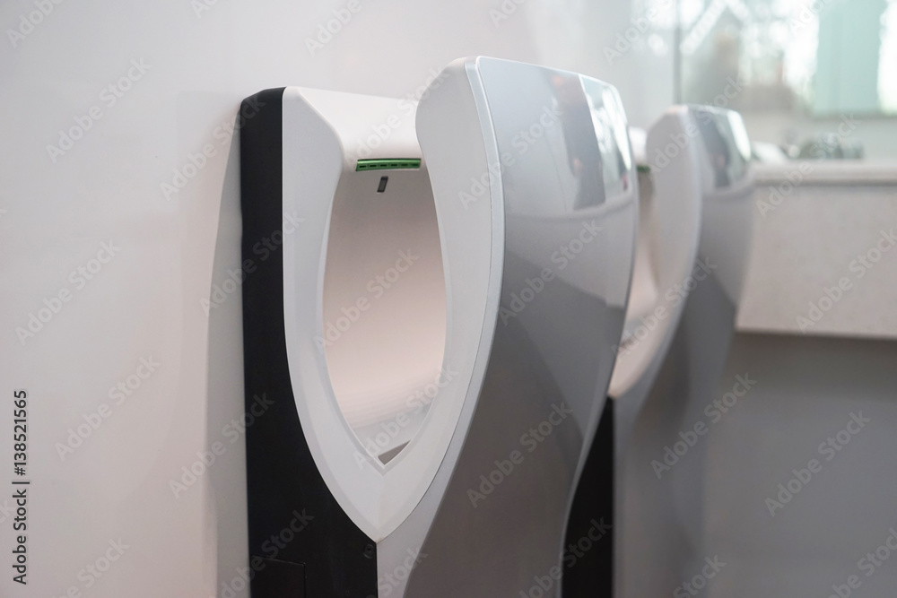 Hand dryer in public WC, closeup Stock Photo | Adobe Stock