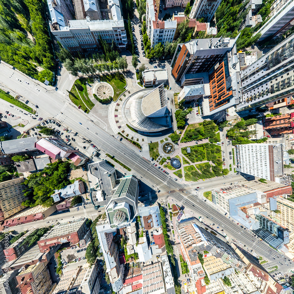 Aerial city view with crossroads, roads, houses, buildings, parks and ...
