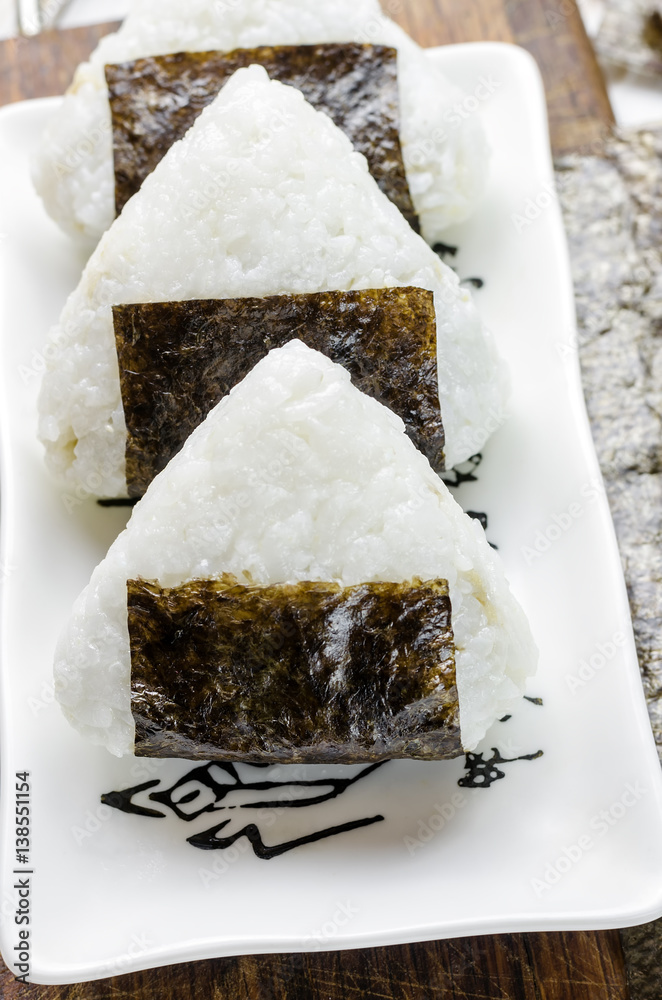 Onigiri. Rice triangle with nori. Stock Photo | Adobe Stock