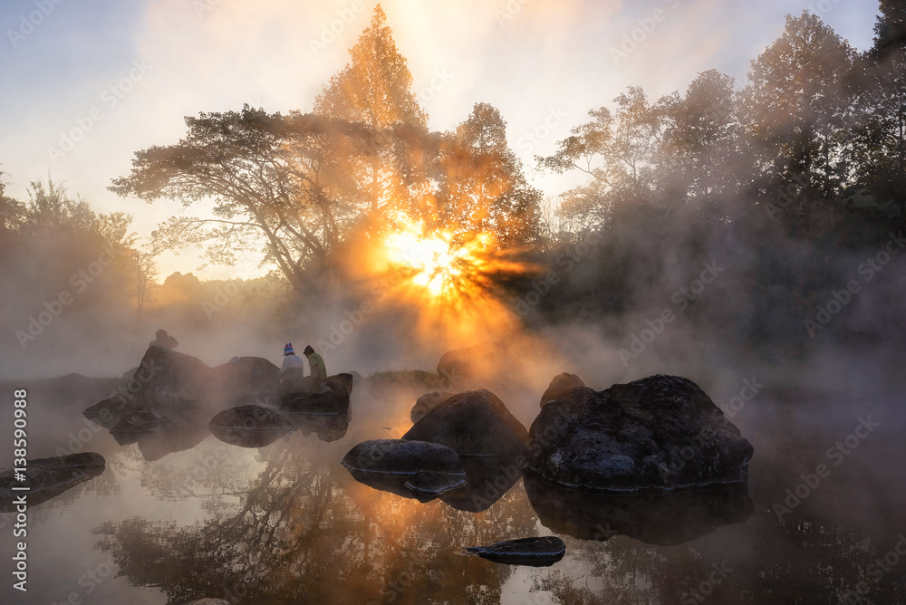 The hot spring with a 73 degree Celsius water spring over rocky terrain ...