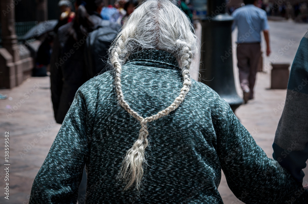 Old peruvian woman with typical peruvian hairstyle Stock Photo | Adobe ...