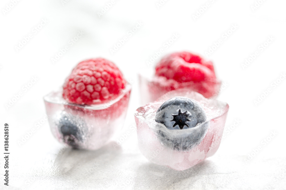 ice cubes with raspberry and blueberry on white background Stock Photo ...