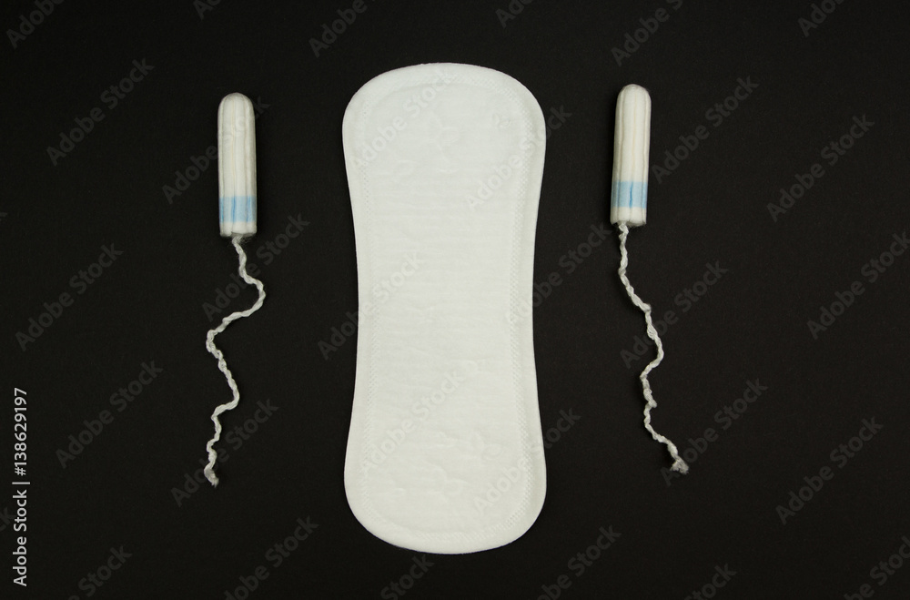 Women Sanitary pads and tampons on a black background. Stock Photo ...
