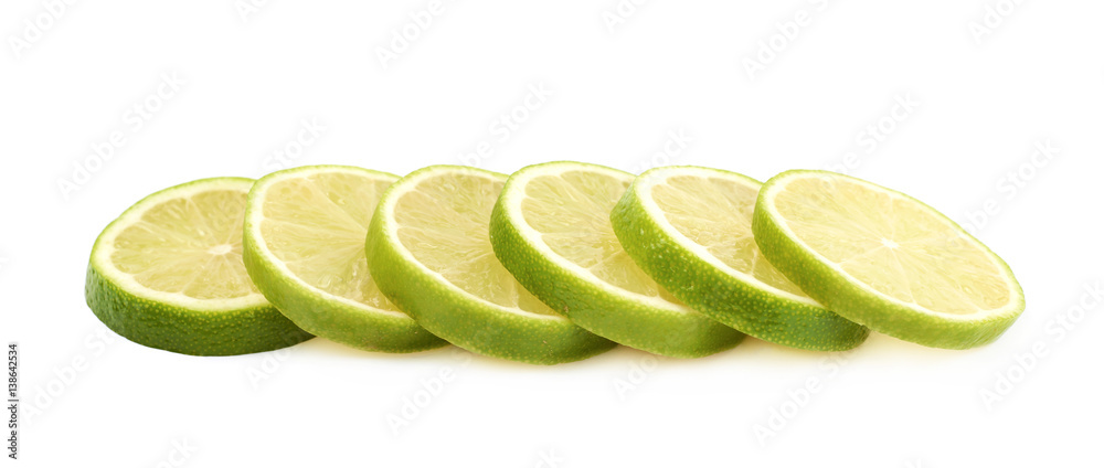 Pile of multiple lime slices isolated Stock Photo | Adobe Stock