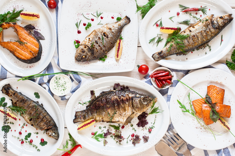 Assortment of fried fasting fish dishes flat lay. Top view on grilled ...