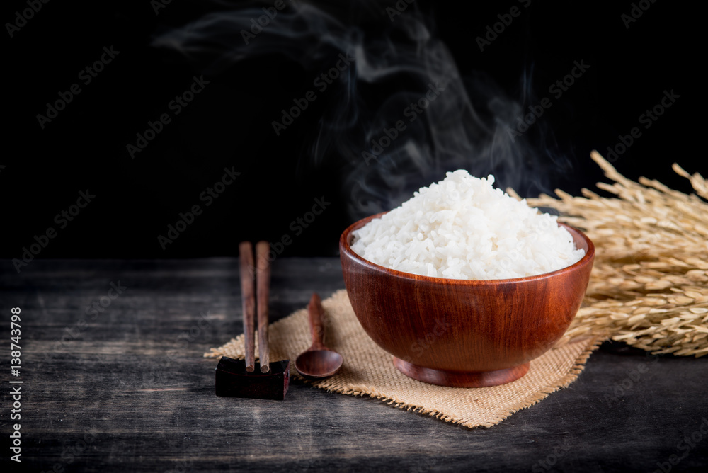 Cooked rice with smoke in wooden bowl,dark background Stock Photo ...