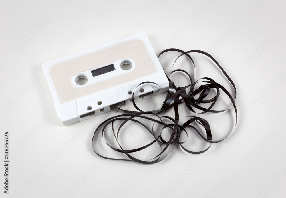 Foto Stock Audio cassette with pull-out tape | Adobe Stock