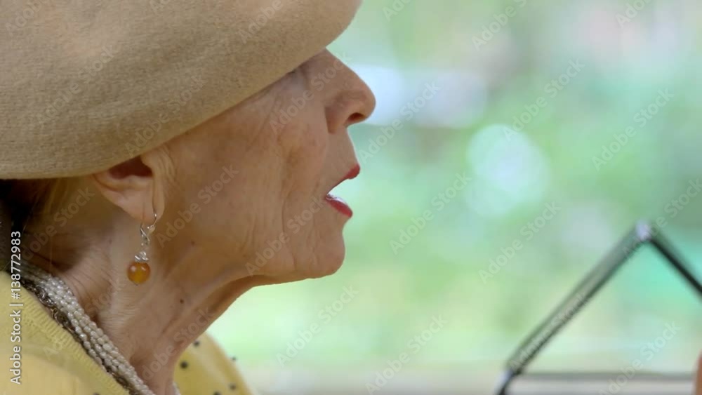 Senior woman talking. Side view of female face. Just do as I say. Stock ...