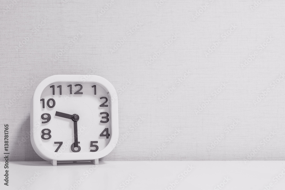 Closeup white clock for decorate show half past nine or 9:30 a.m. on ...