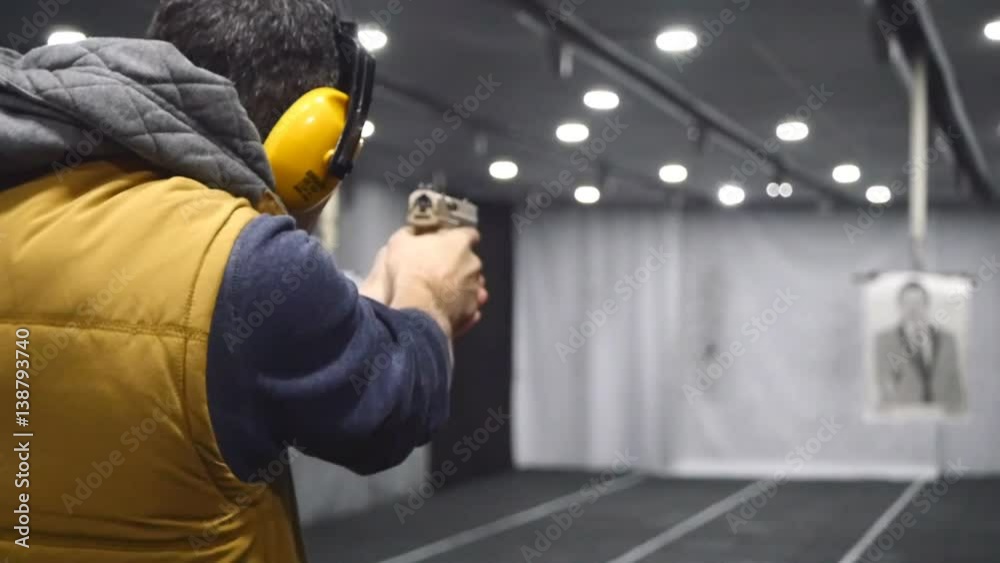 Man shooting with a pistol in slow motion Stock Video | Adobe Stock