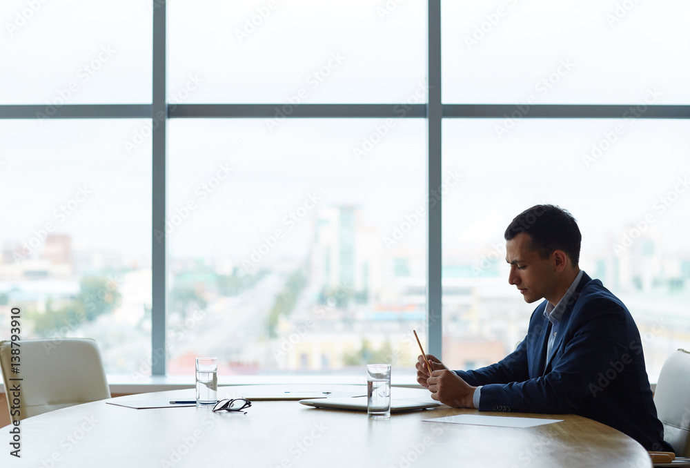 Man Alone At Long Table
