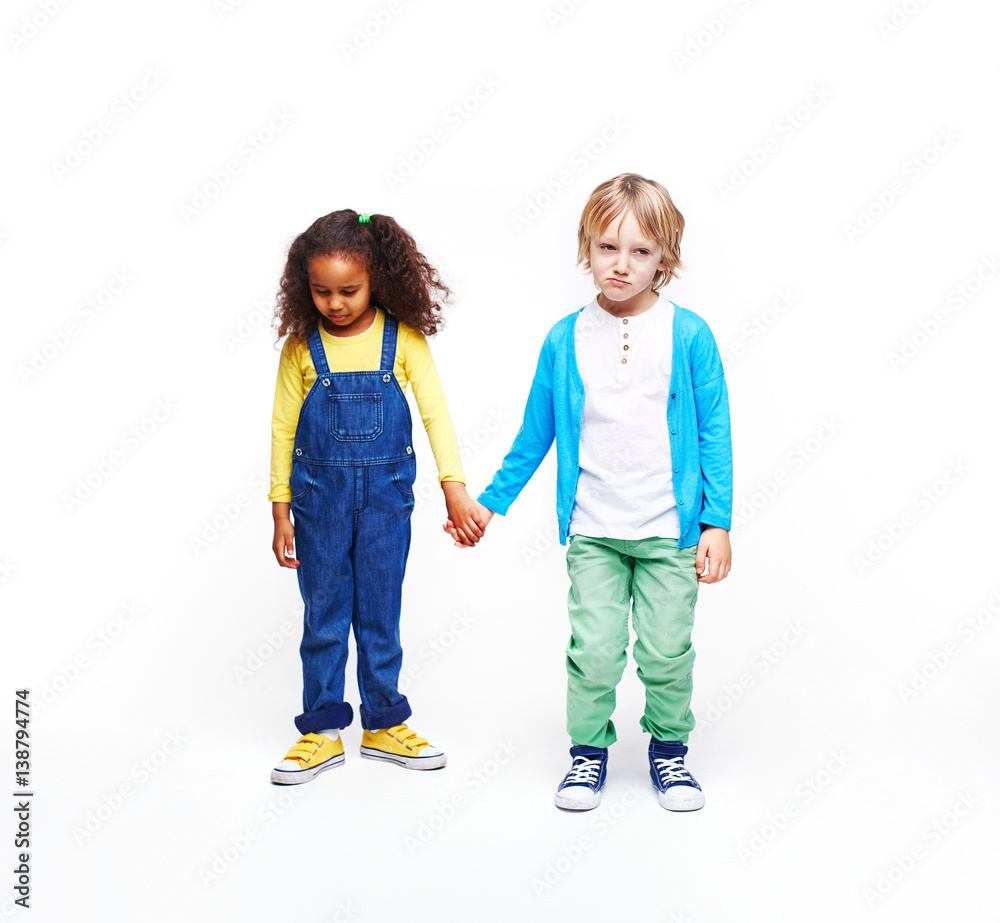 Studio portrait of children against white background: full body shot of ...